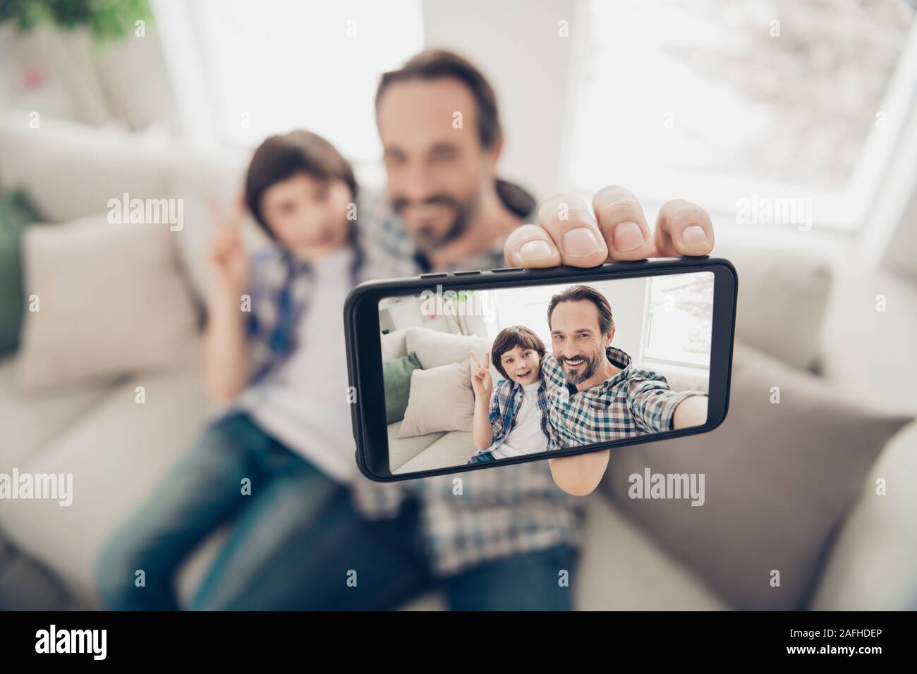 Phto portrait of handsome positive cheerful dad hugging embracing his ...