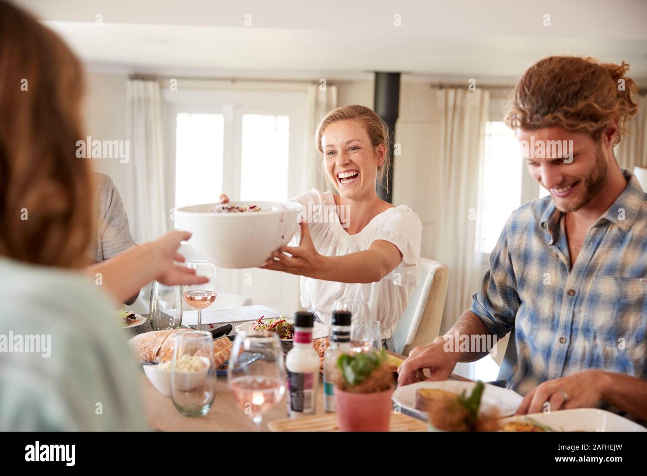 Passing food dinner table hi-res stock photography and images - Alamy