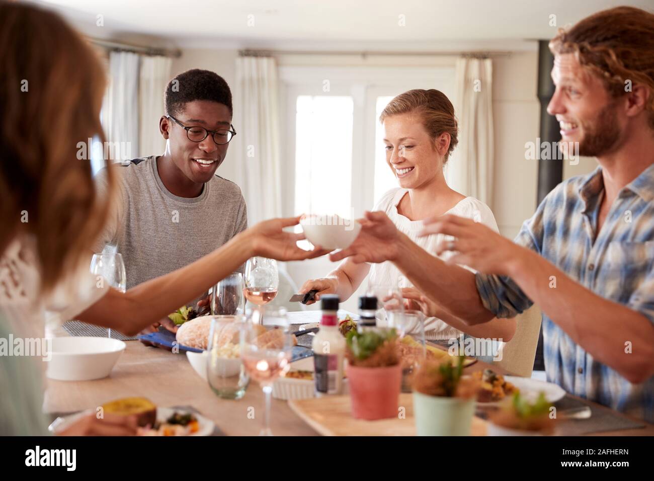 Reaching across table hi-res stock photography and images - Alamy
