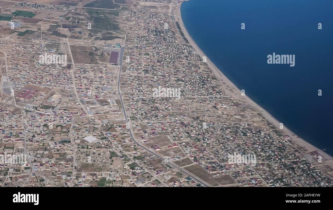 Aerial view from plane on seascape with coastal city in Turkey. Flying ...