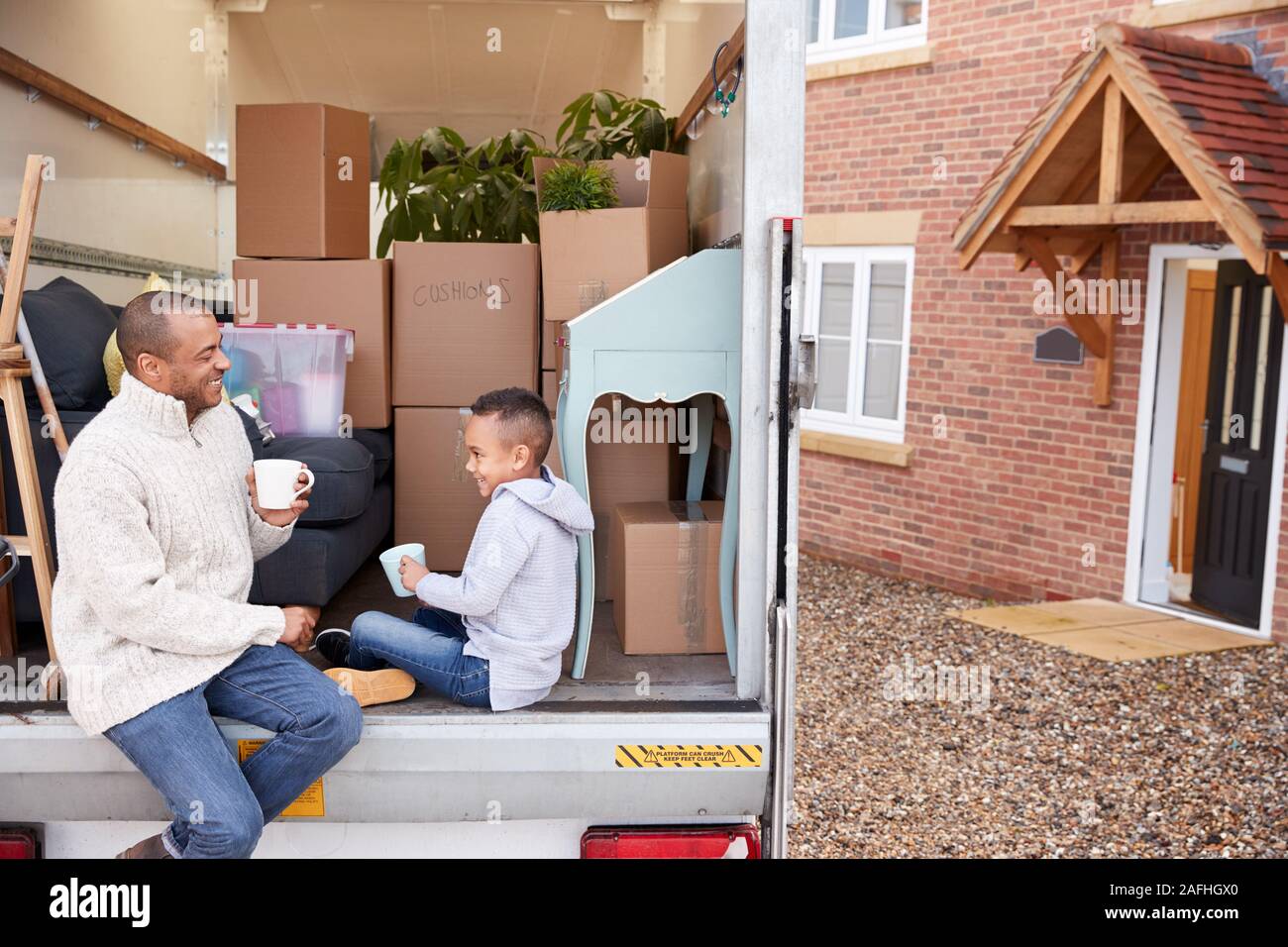 Sitting on tailgate hi-res stock photography and images - Alamy