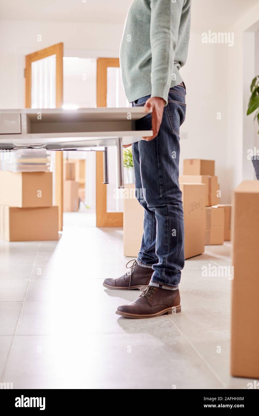Men carrying table hi-res stock photography and images - Alamy