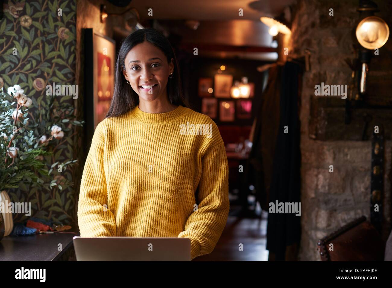 Hispanic female working laptop hi-res stock photography and images - Alamy