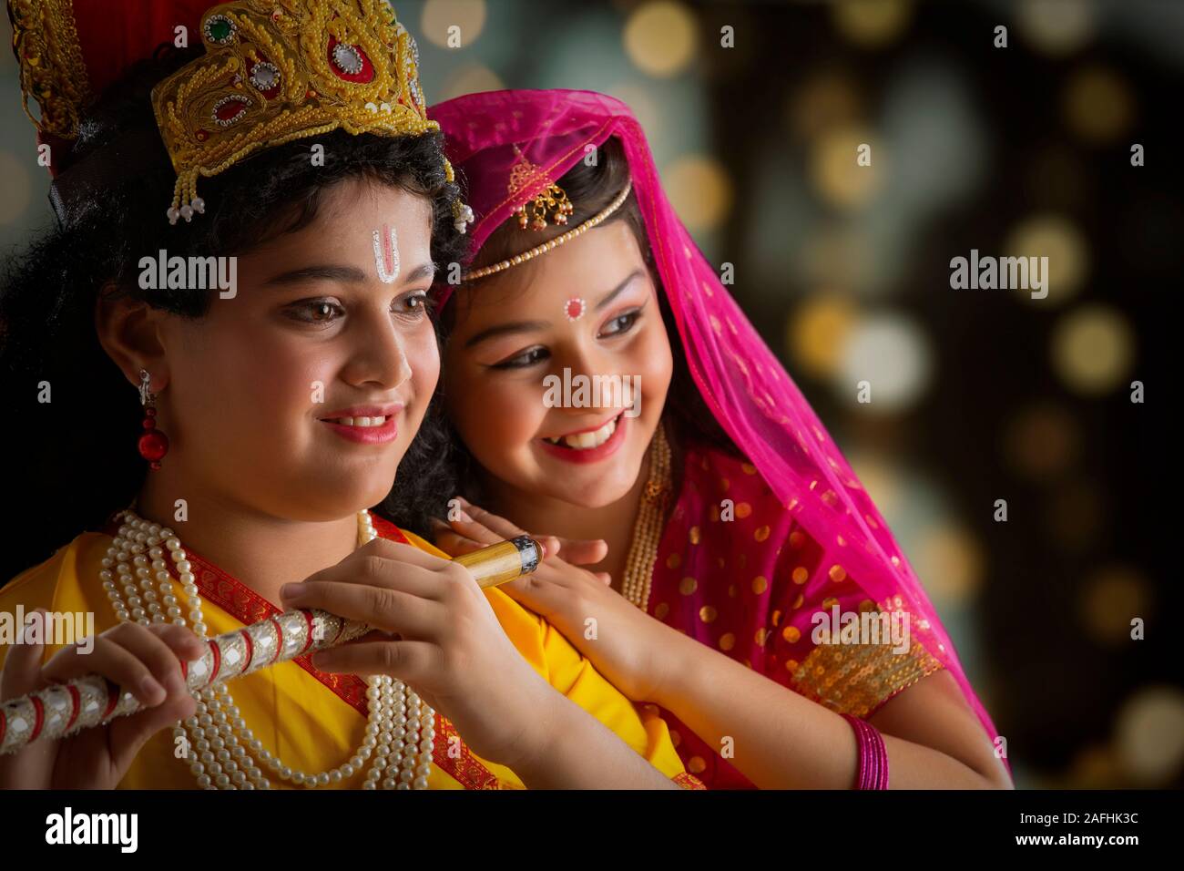 young Radha and Krishna smiling Stock Photo - Alamy
