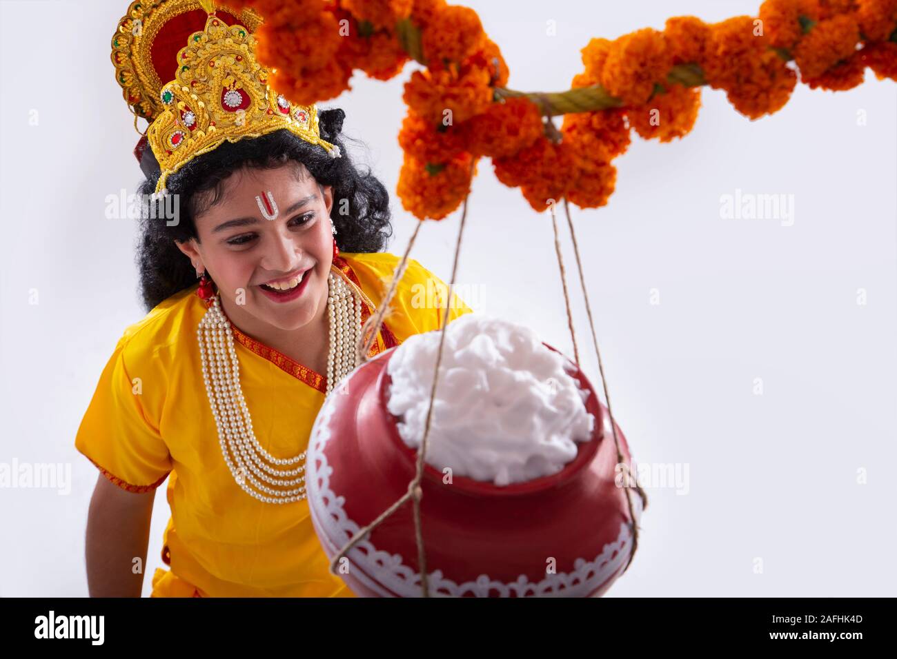 portrait of young krishna looking at dahi handi Stock Photo - Alamy
