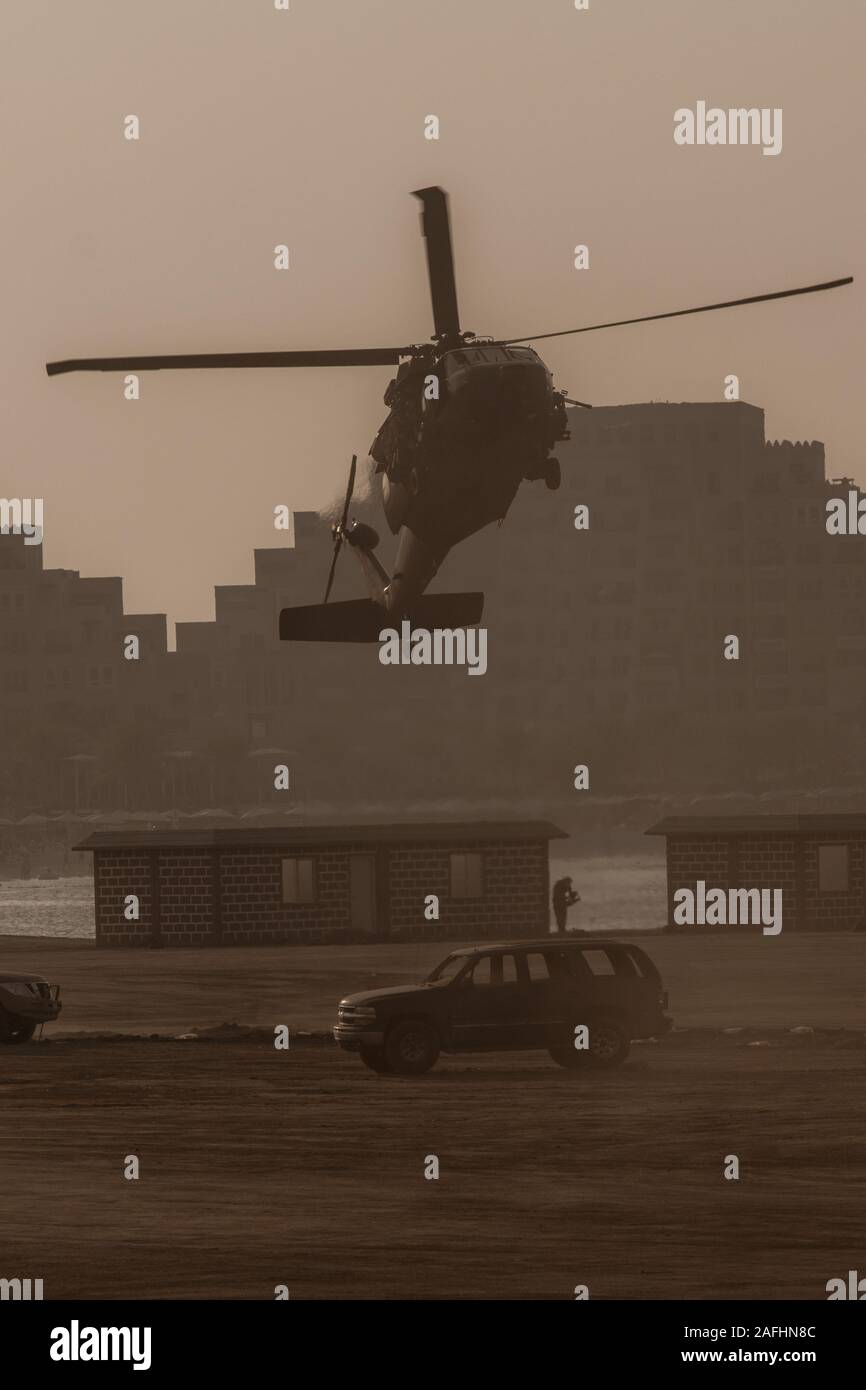 Close up of Military combat and war with helicopter flying into the ...