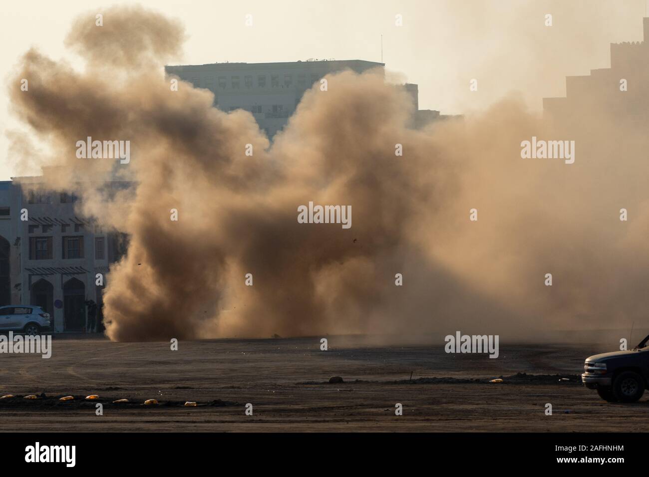 Military strike or bomb in war causes fire ball and explosion amid cars ...