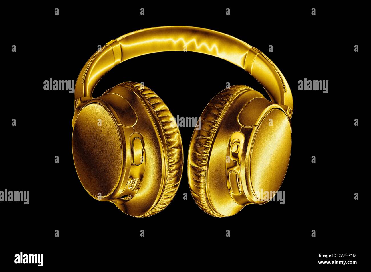 Golden shiny wireless headphones on black background isolated close up ...