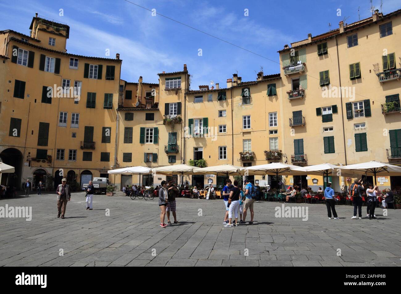 LUCCA, ITALY - APRIL 29, 2015: People visit Old Town square (Piazza ...
