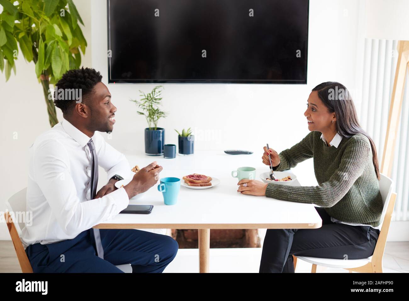 Business Couple At Home Eating Breakfast Before Leaving For Work Stock ...