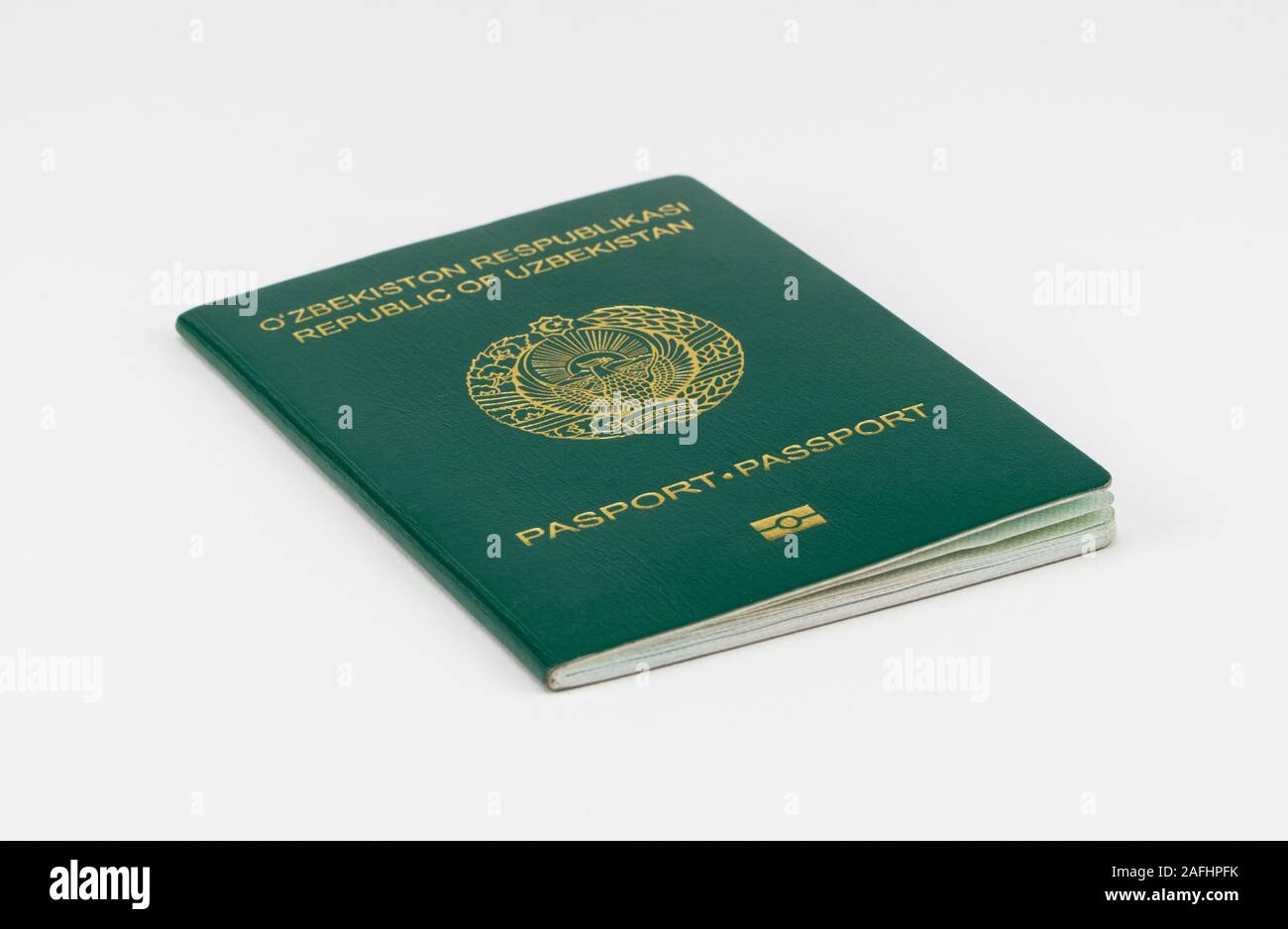 Uzbekistan passport on a white background, isolated Stock Photo - Alamy