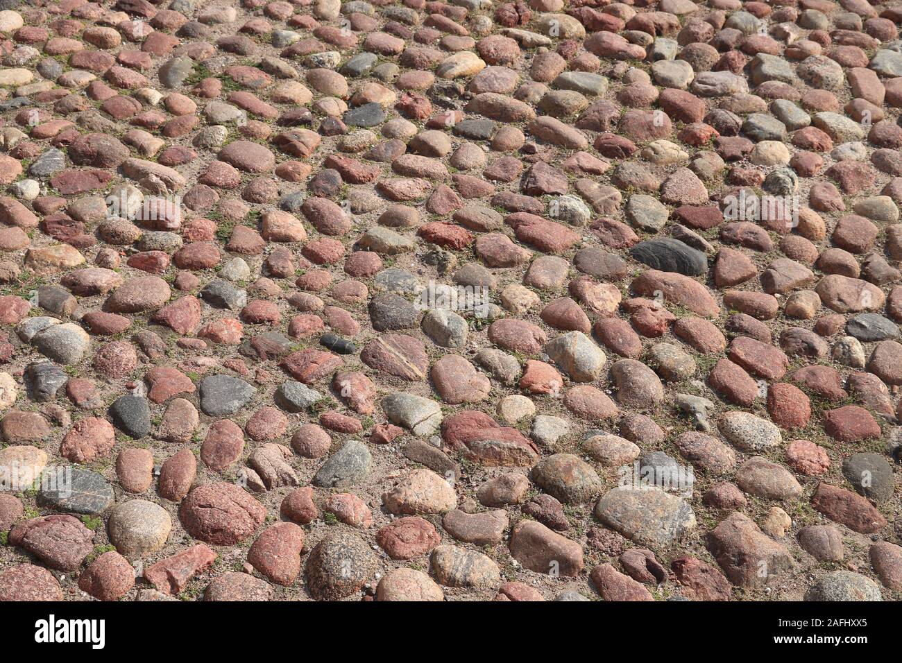 Stone paving background - red granite cobblestone pattern in Stockholm ...