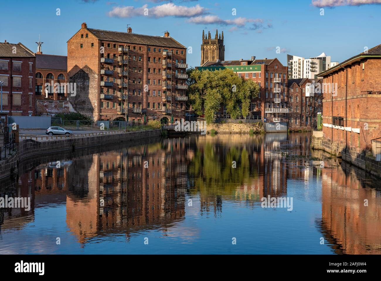 LEEDS, UNITED KINGDOM - AUGUST 13: View of old riverside city buildings ...