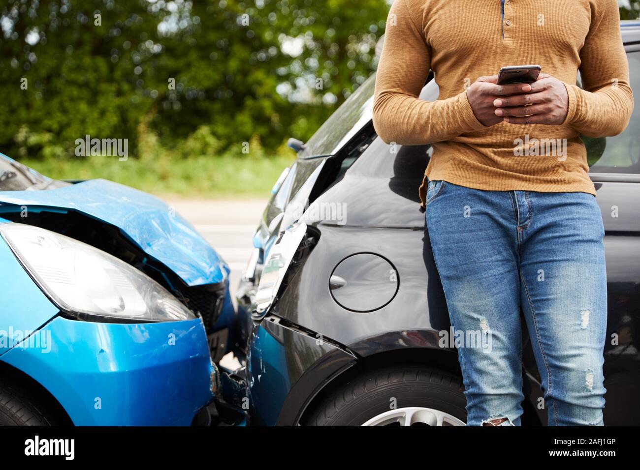 Male Motorist Involved In Car Accident Calling Insurance Company Or ...