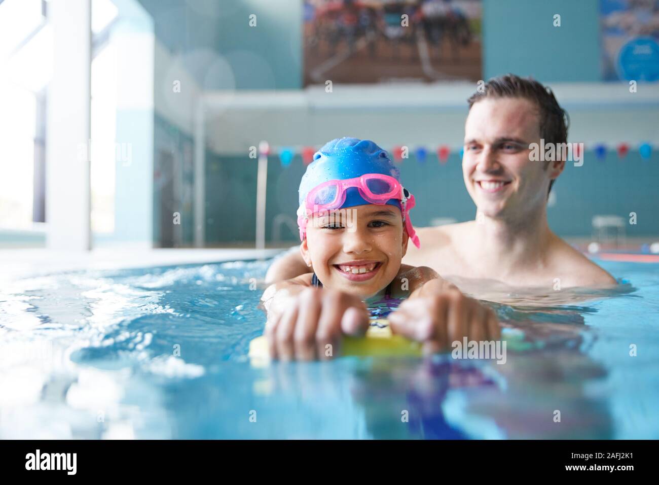 Female coach with swim team hi-res stock photography and images - Alamy