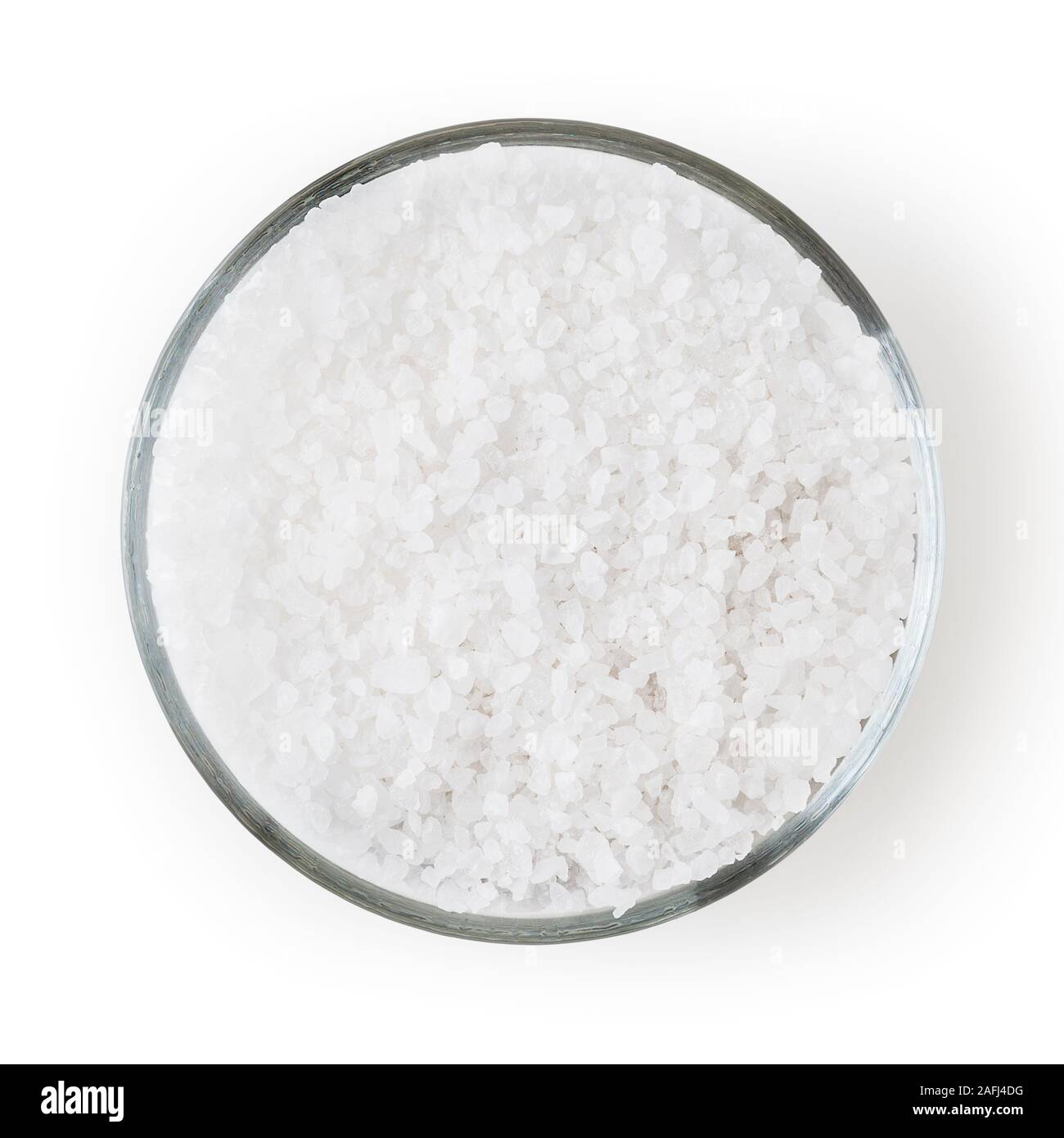 Sea salt in glass bowl isolated on white background with clipping path ...