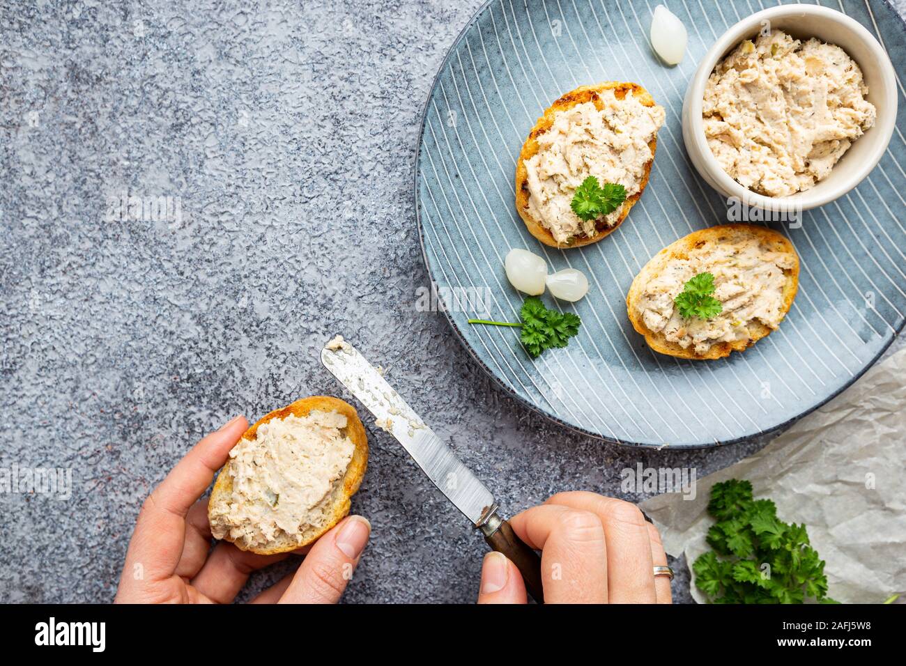 Sandwiches with salmon pate and baguette, fish bruschetta, top view ...