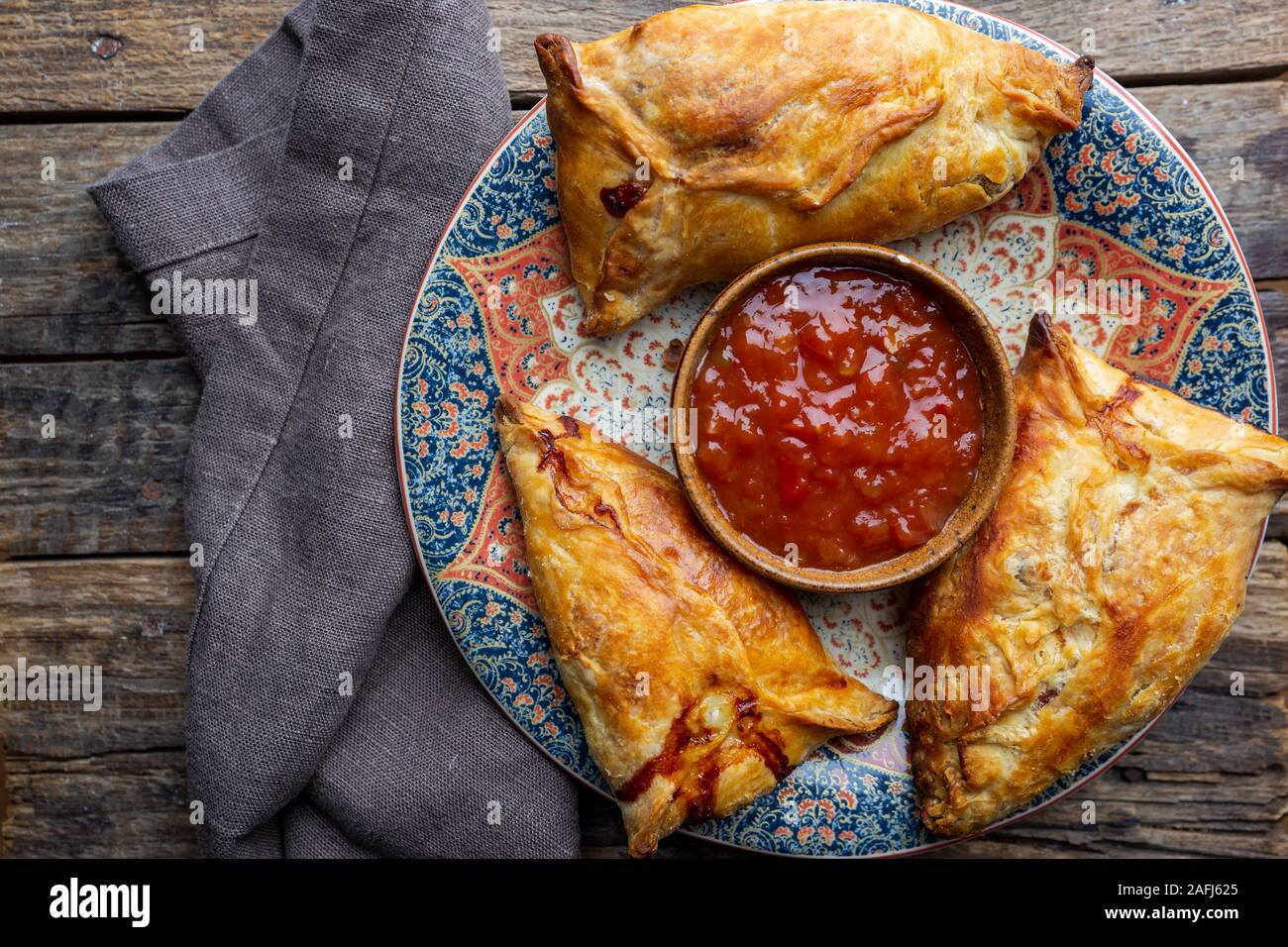 Asian food Samsa or samosas with chicken fillet on a plate. Top view ...