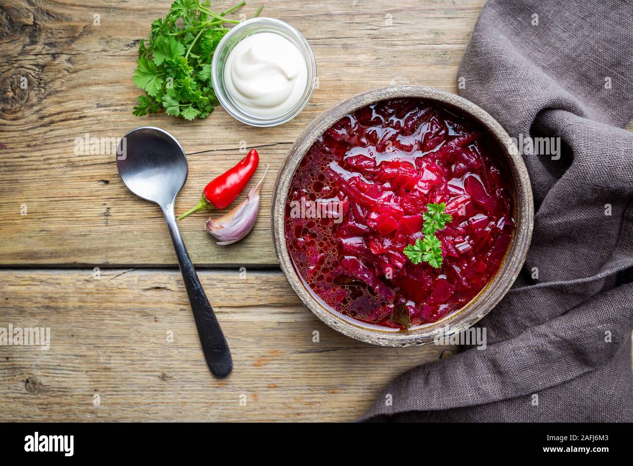 Traditional Ukrainian Russian vegetable beet soup, borscht on wooden ...