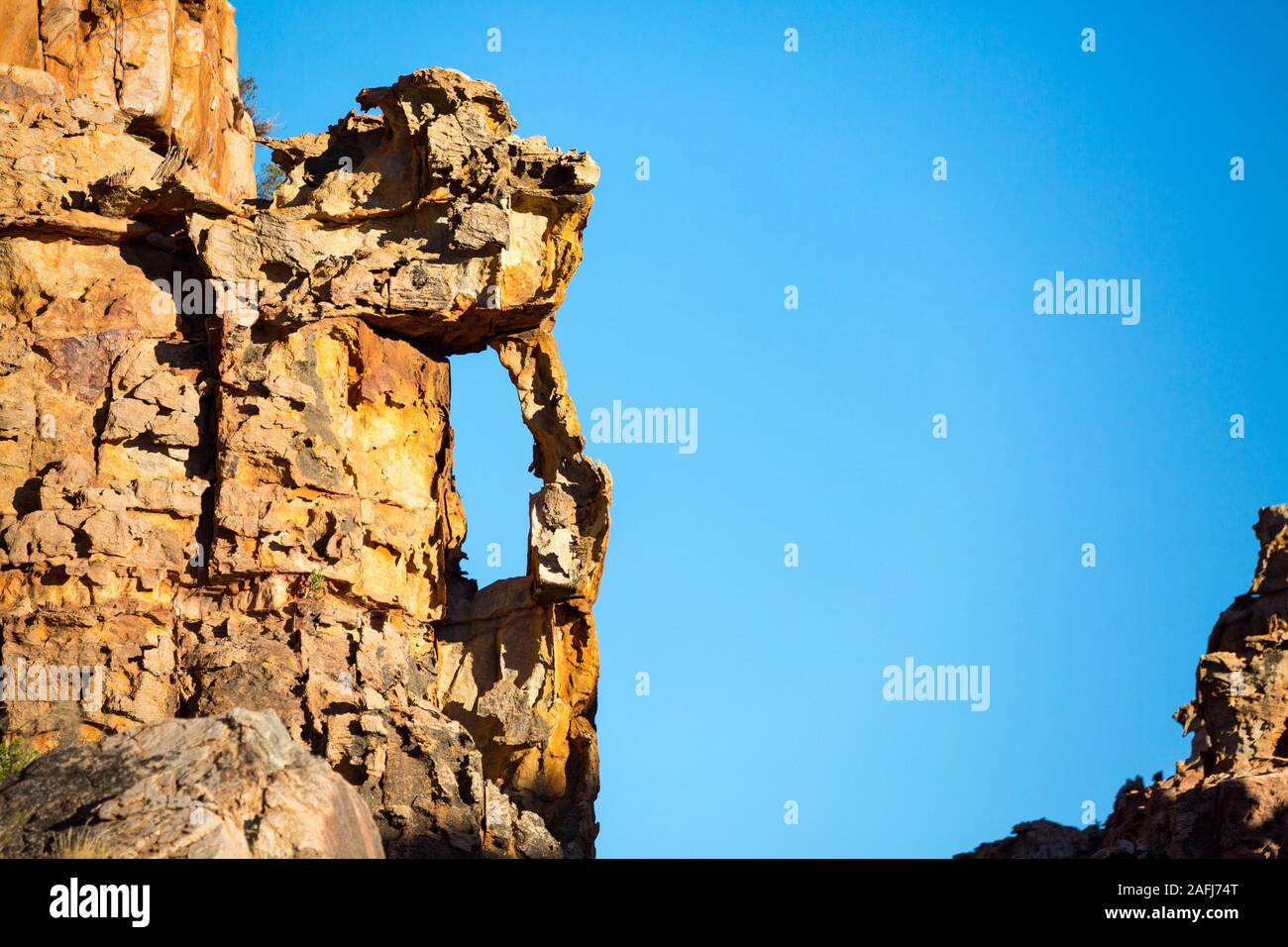 Detail of an unstable rock formation in the evening light ...