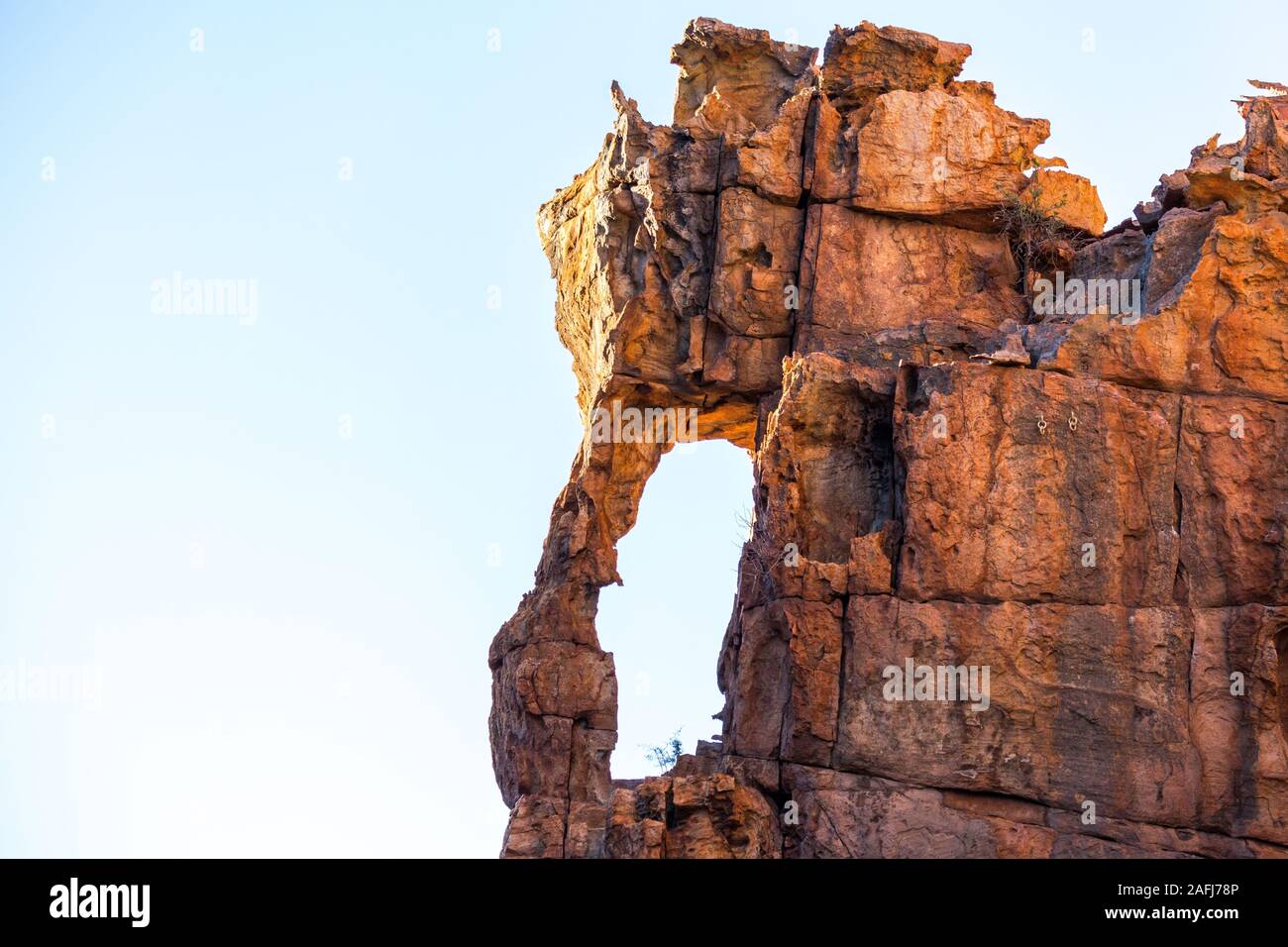 Detail of an unstable rock formation in the evening light, isolated on ...