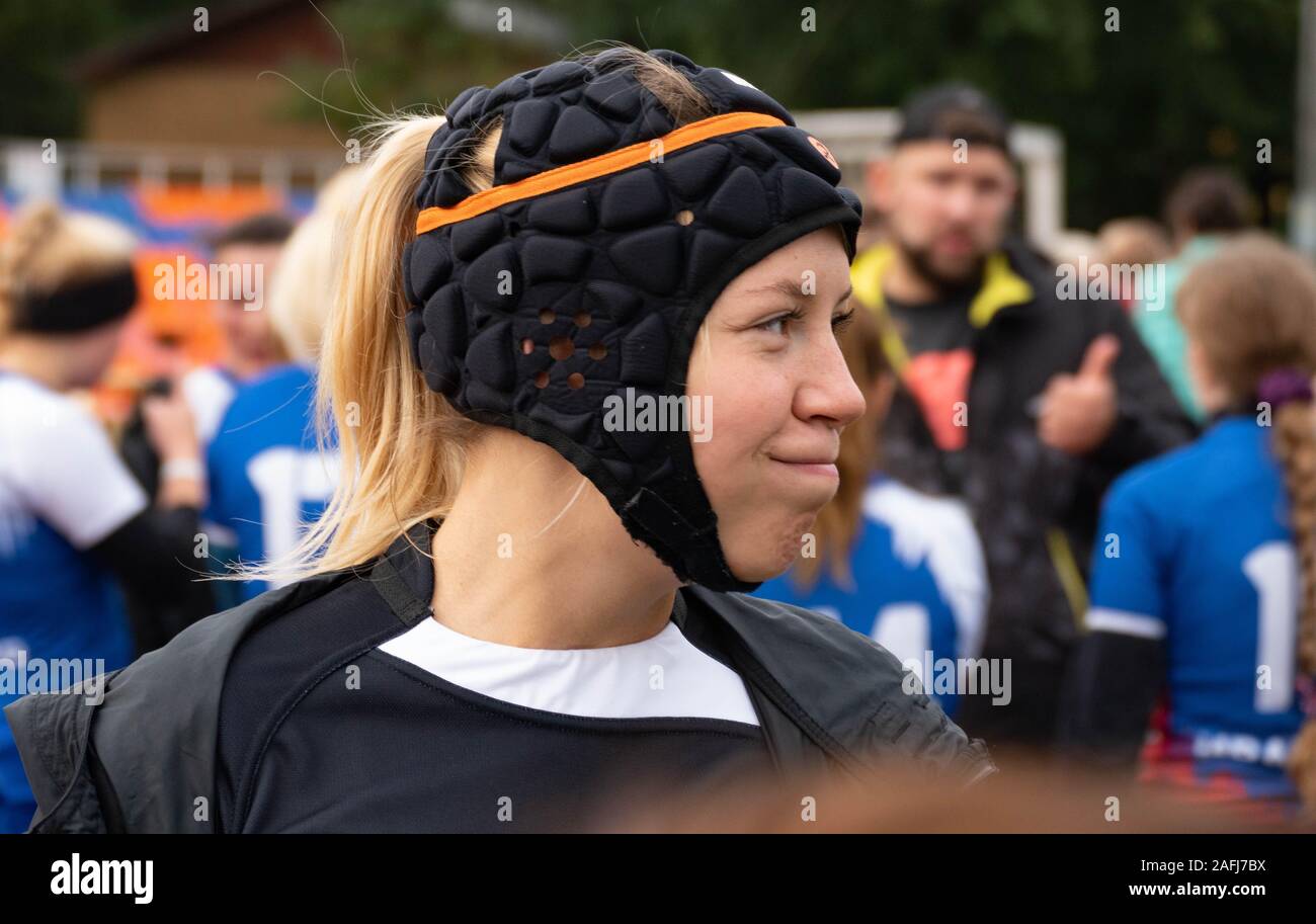 Girl athlete rugby player in a cap Stock Photo - Alamy