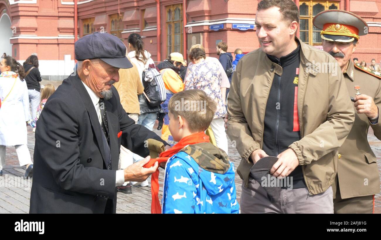 Lenin and Stalin present a pioneer tie in Red Square Stock Photo - Alamy