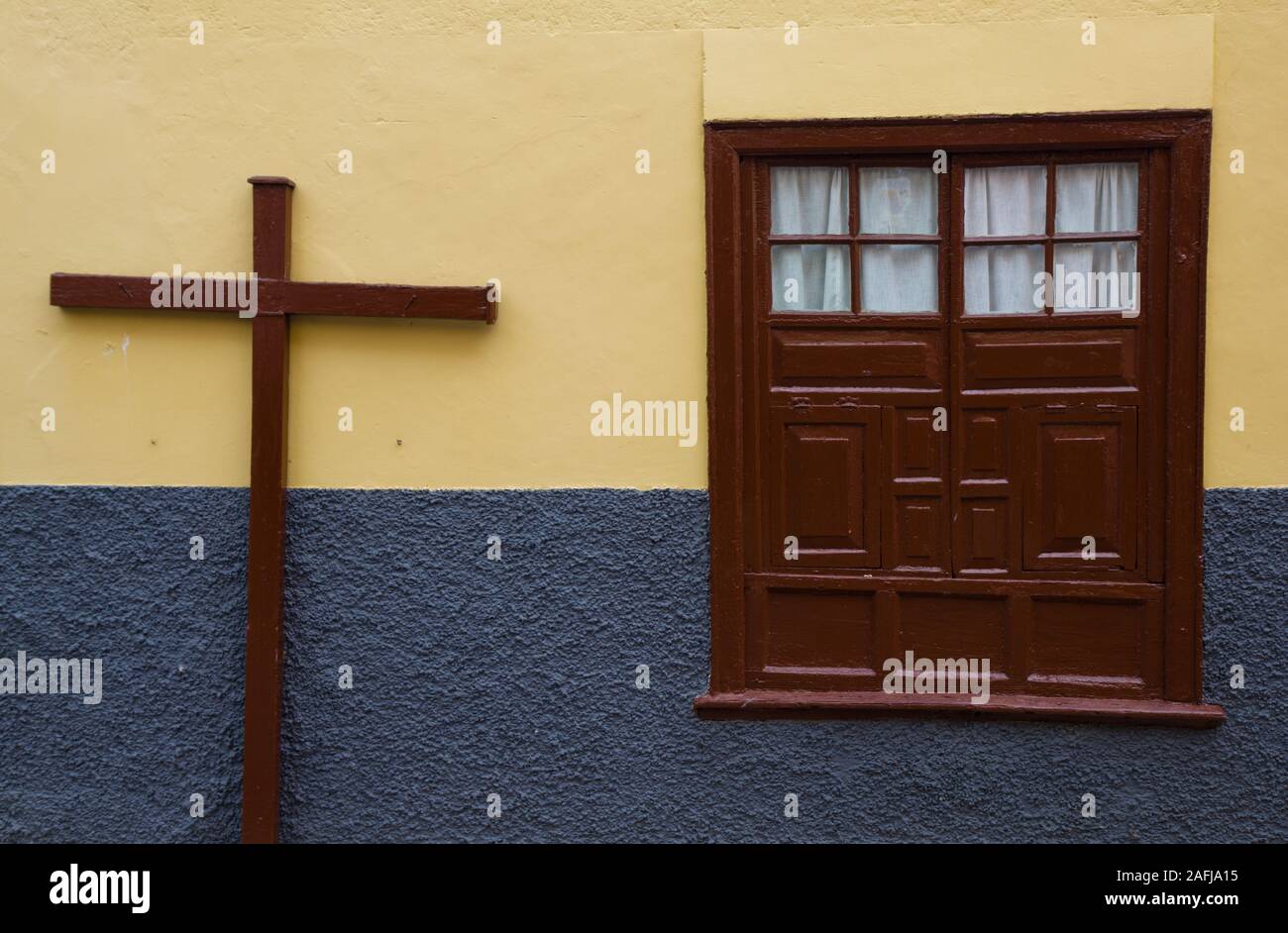 Facade of a house with window and cross Stock Photo - Alamy