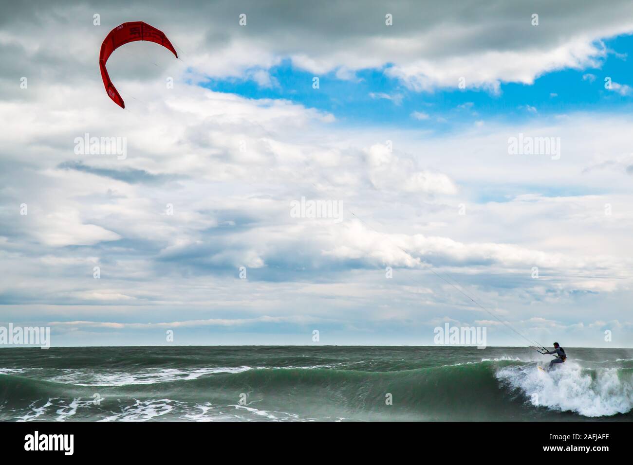 Kite surfing on a wave Stock Photo - Alamy