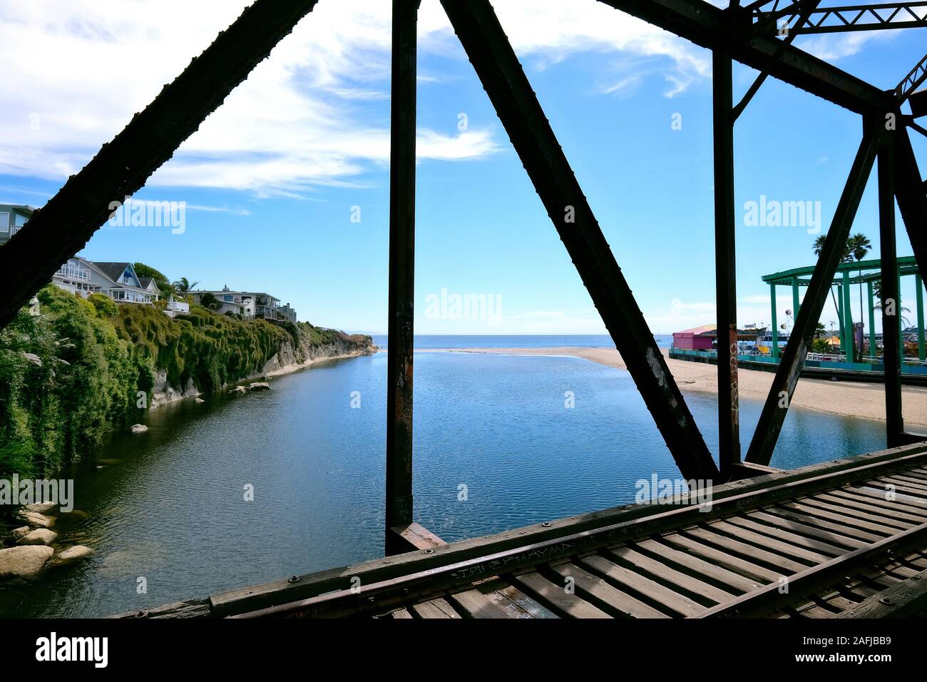 Old railway bridge over the San Lorenzo River at the beach promenade of ...