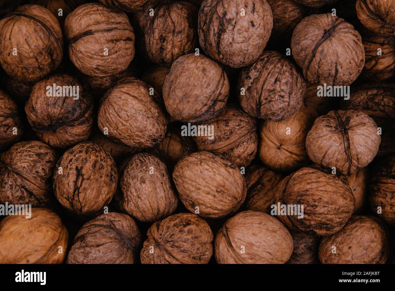 Natural walnut background pattern texture. Abstract walnuts heap ...