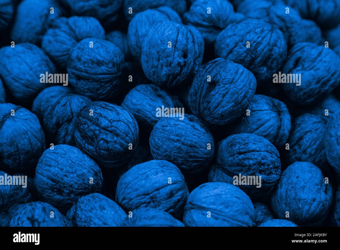 Natural walnut background pattern texture in trendy classic blue color ...