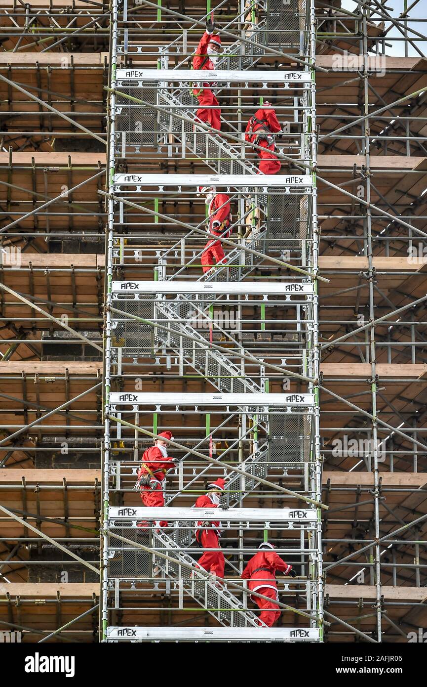 Scaffolders get into the festive spirit and dress in Santa outfits as ...