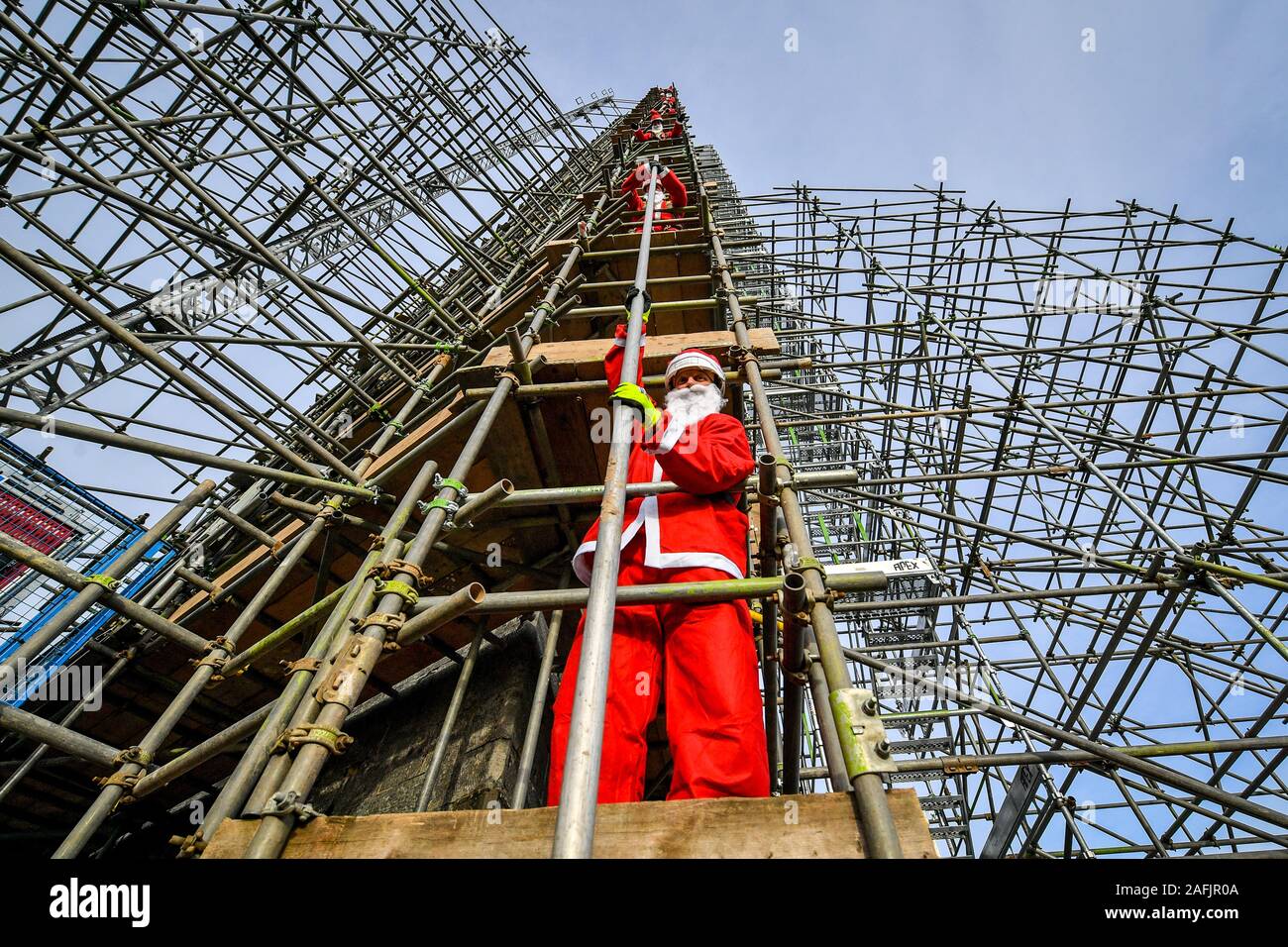 Scaffolders get into the festive spirit and dress in Santa outfits as ...