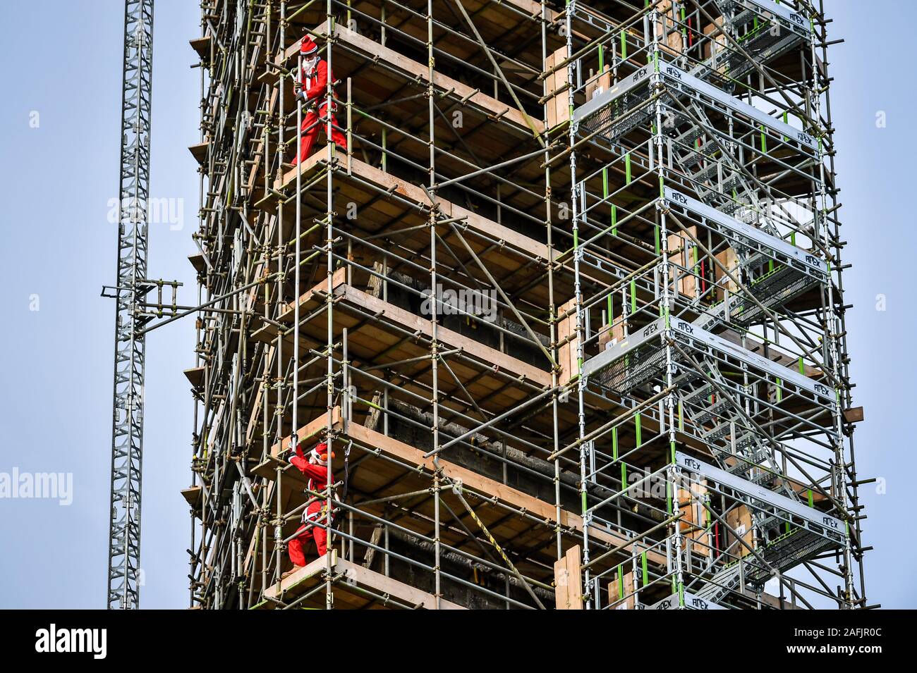 Scaffolders get into the festive spirit and dress in Santa outfits as ...