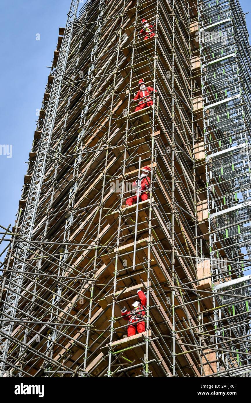 Scaffolders get into the festive spirit and dress in Santa outfits as ...