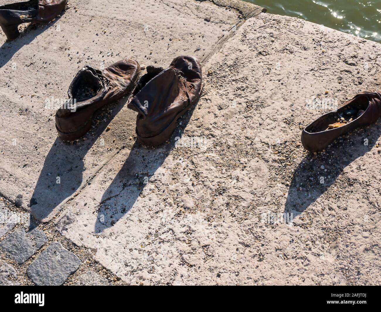This memorial is simple yet chilling, depicting the shoes left behind ...