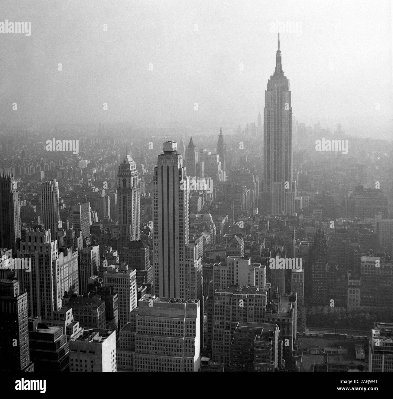 The Emire State Building and the tower buildings around Stock Photo - Alamy