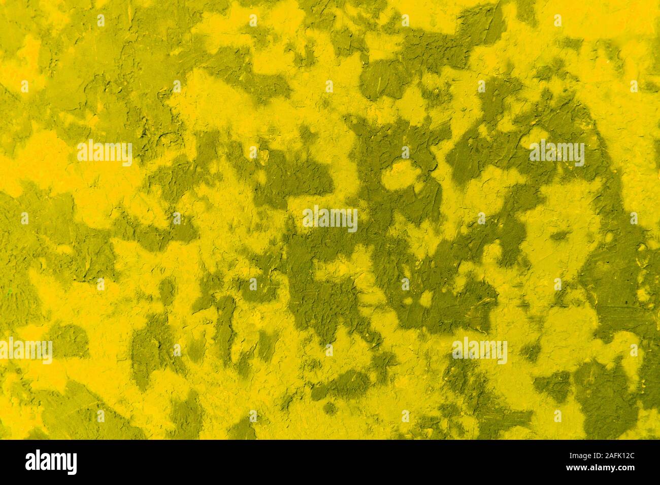 Bright abstract texture of wet plaster on the wall, yellow color and ...
