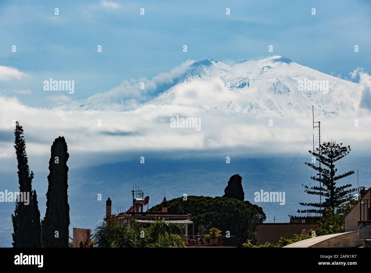 snow covered volcano Etna during abnormally cold spring, Taormina ...