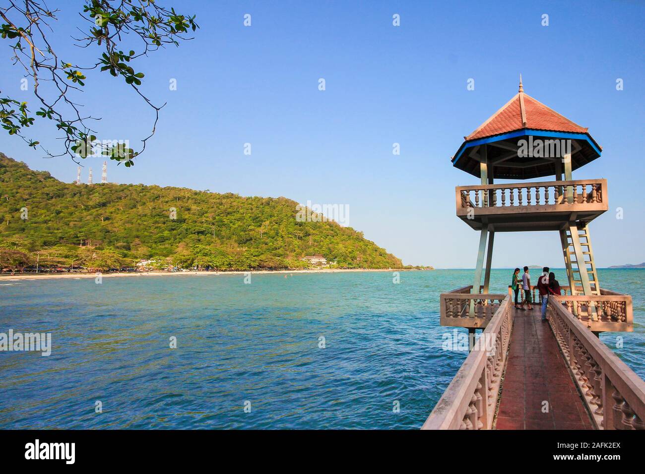 Pier with lookout by Kep Beach's leafy bay, with the National Park ...