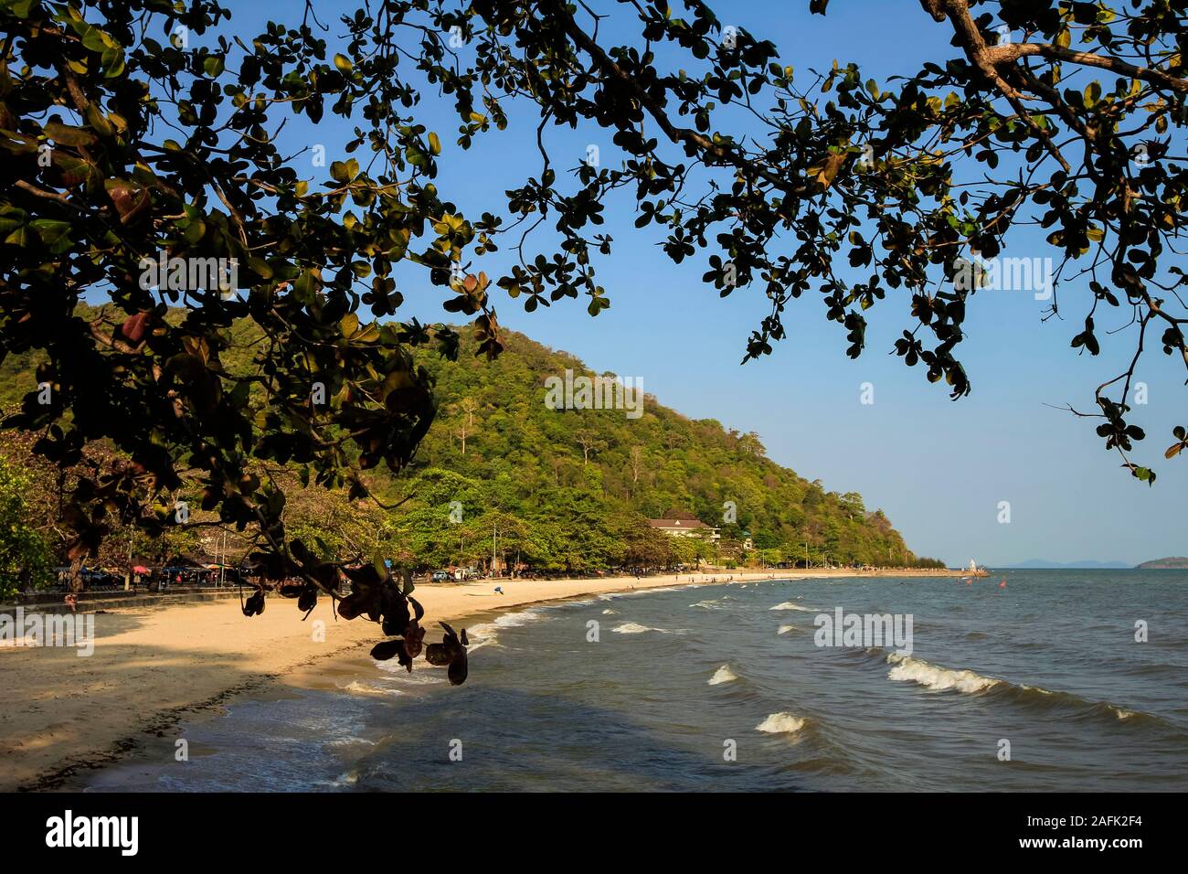 The leafy bay at popular Kep Beach with the National Park forest behind ...