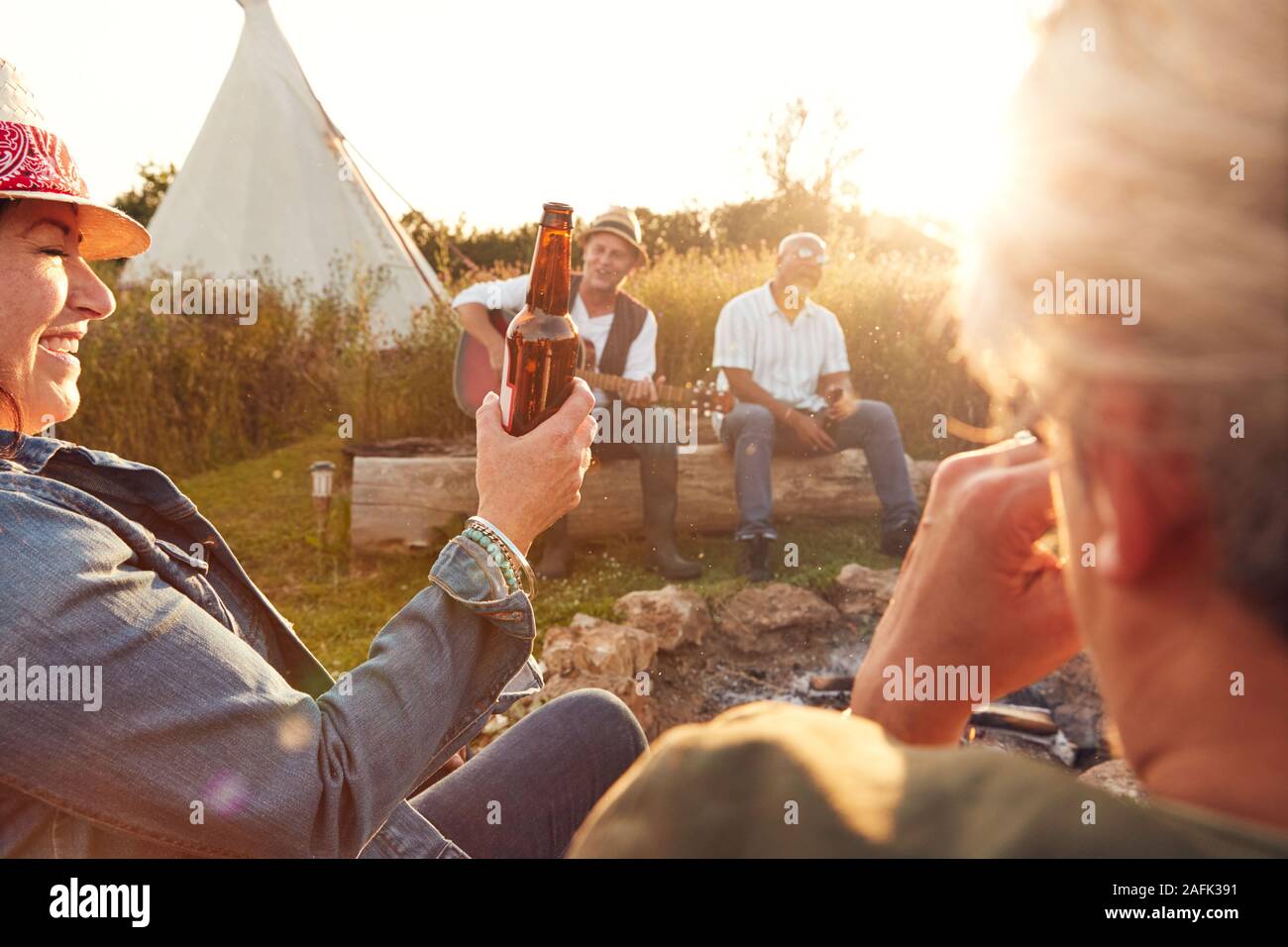 Man sitting fire drink hi-res stock photography and images - Alamy