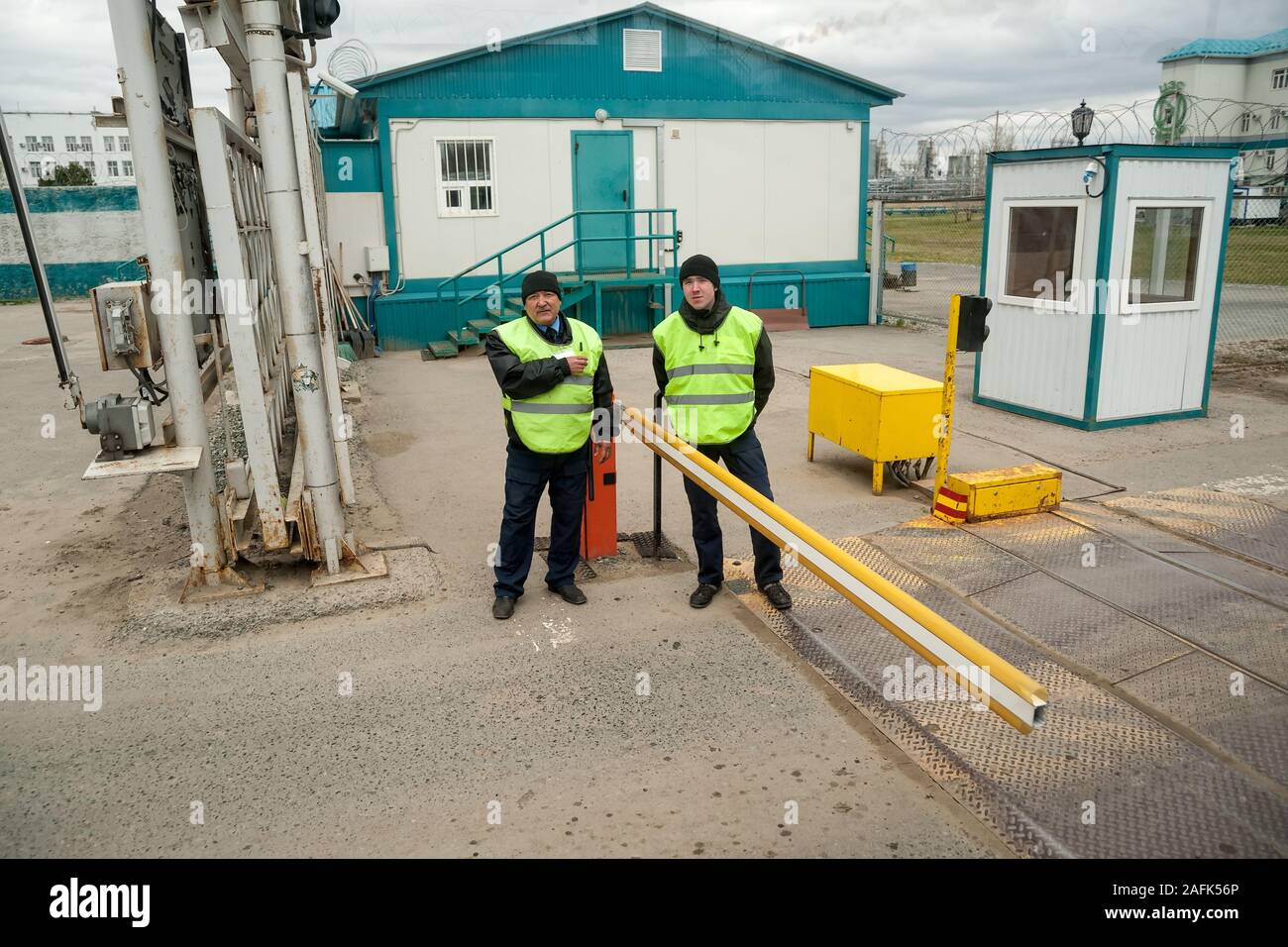 Security guard controls access to territory Stock Photo - Alamy