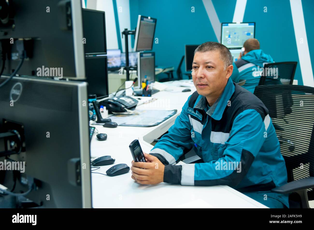 Man in control room of polypropylene factory Stock Photo - Alamy