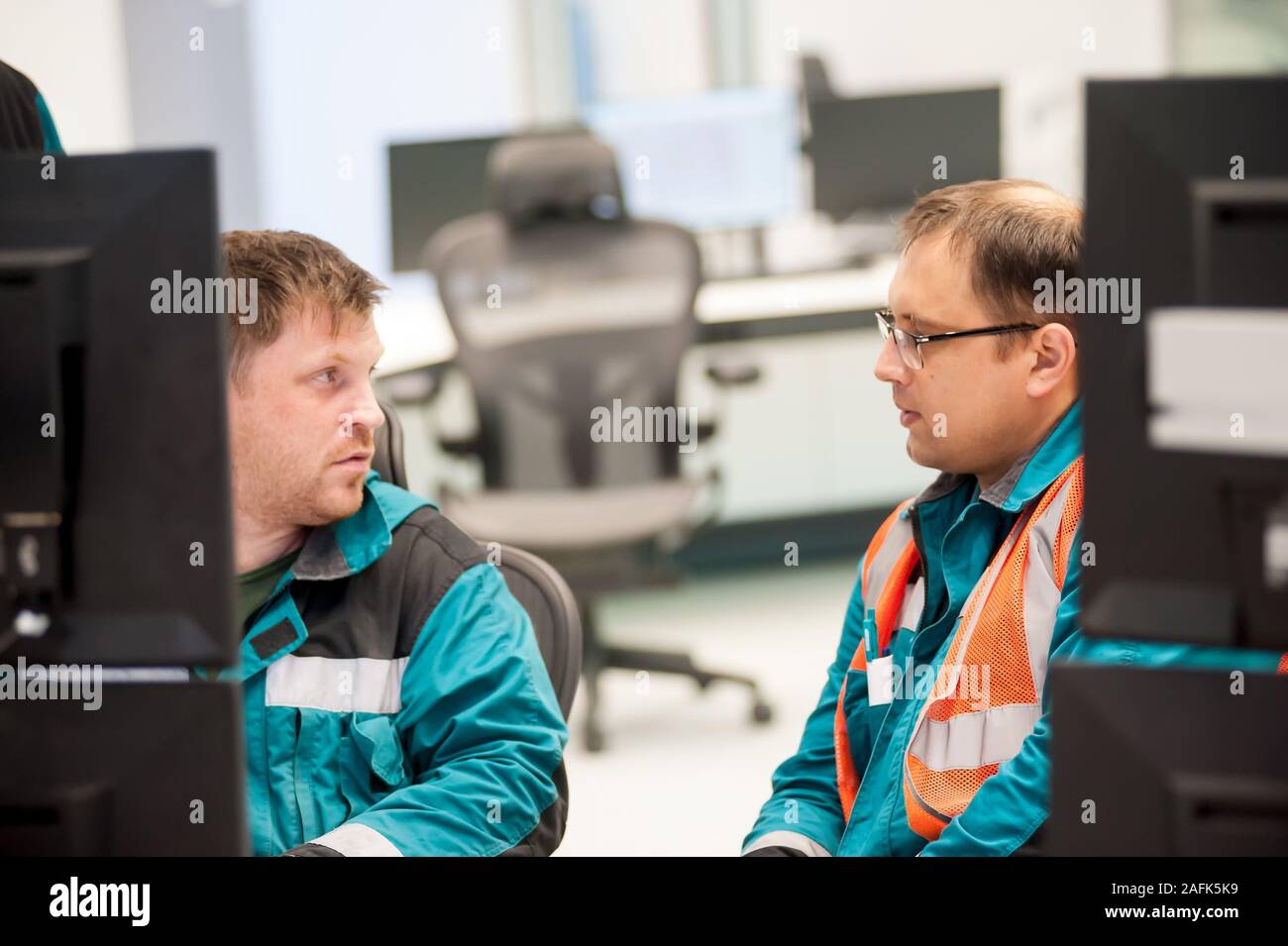 Men in control room of polypropylene factory Stock Photo - Alamy