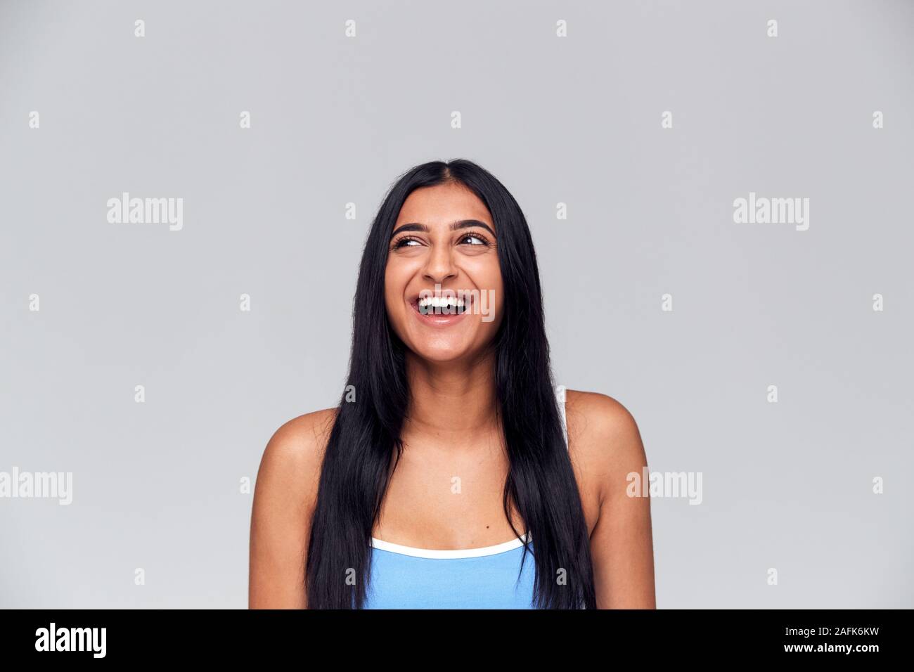 Studio Portrait Of Positive Happy Young Woman Laughing Off Camera Stock ...