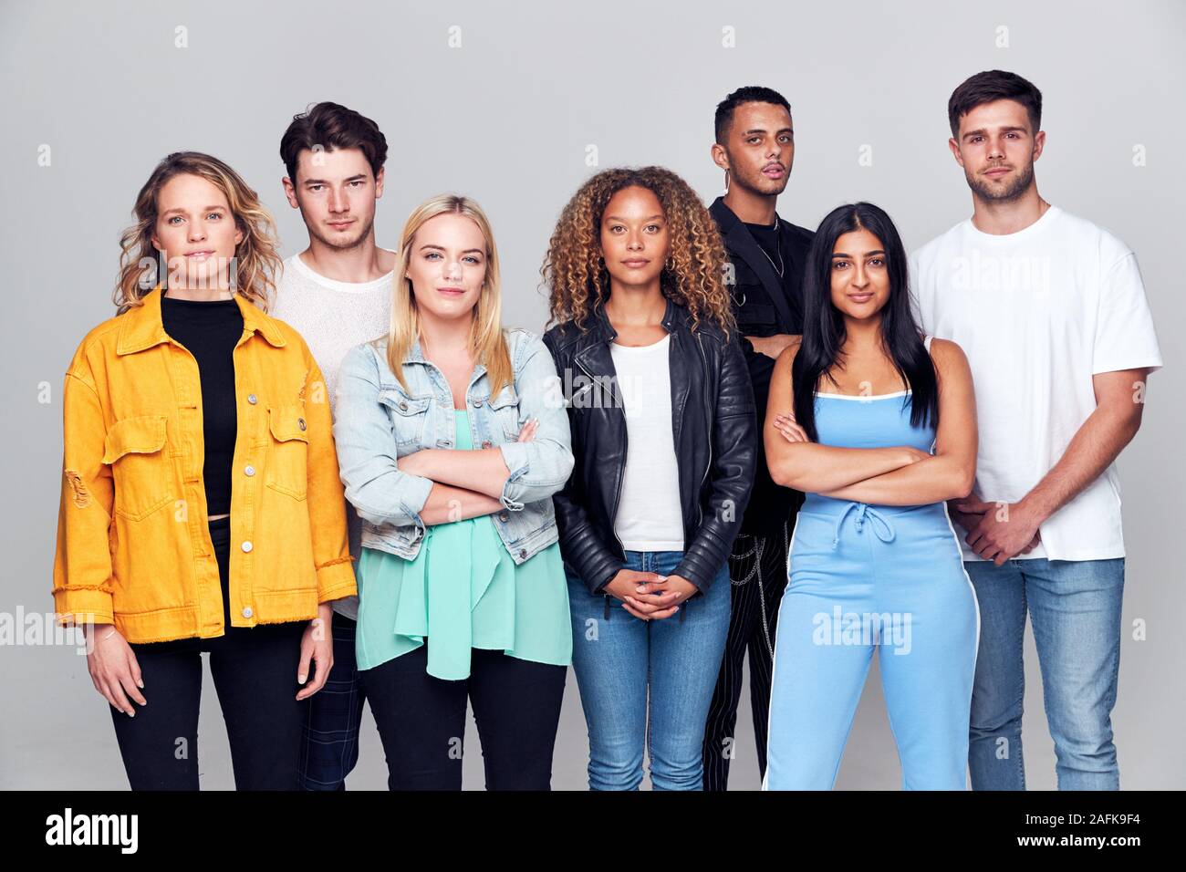 Group Studio Shot Of Young Multi-Cultural Friends Smiling And Laughing ...