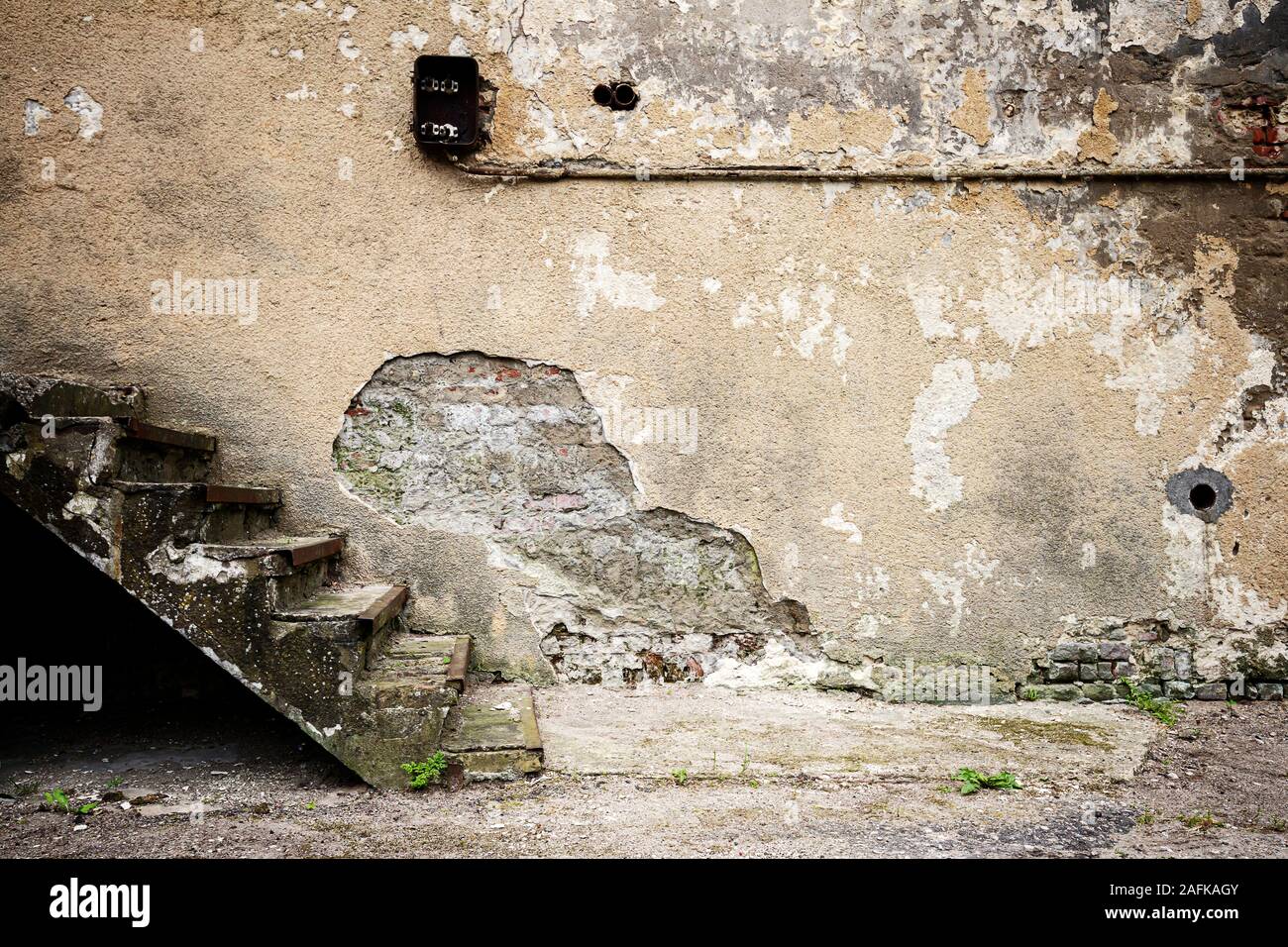 Old brown damaged wall with stairs detail Stock Photo - Alamy