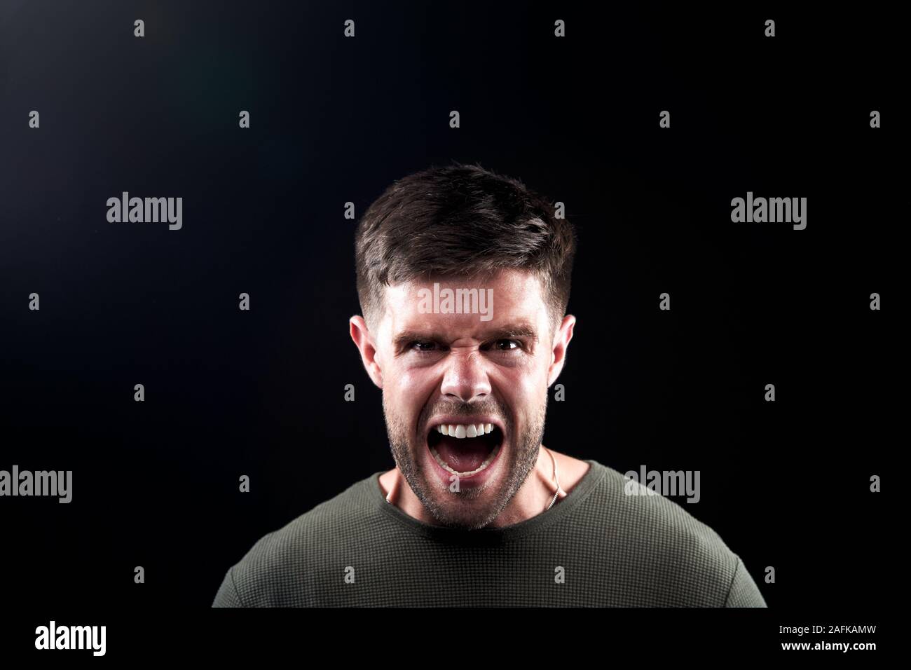 Head And Shoulders Studio Shot Of Angry Man Shouting At Camera Stock ...